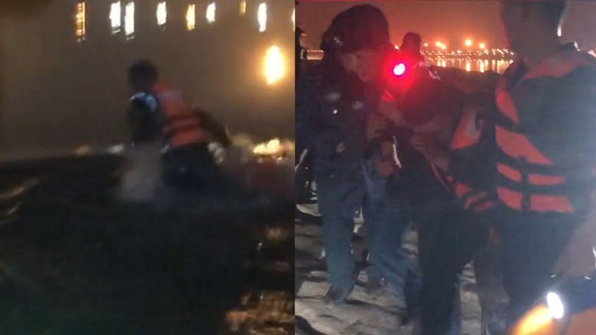 心疼!消防员跳河救落水女子大喊坚持住,上岸冻到失温趴地颤抖