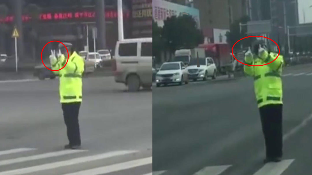 交警自创红绿灯“读秒”手势 超萌动作惹笑众人