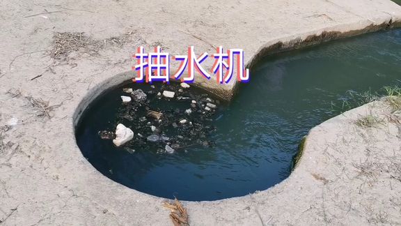广西北流农村水坝抽水机,只看见一根水管,却能抽上水灌溉