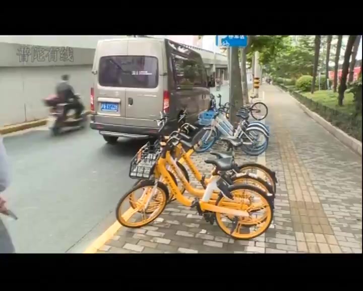 开启管理新举措 单车停放更规范