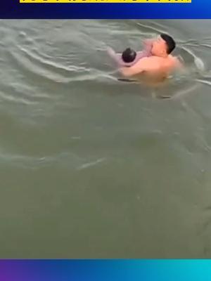 一小孩掉入河中 男子英勇跳入河中营救!