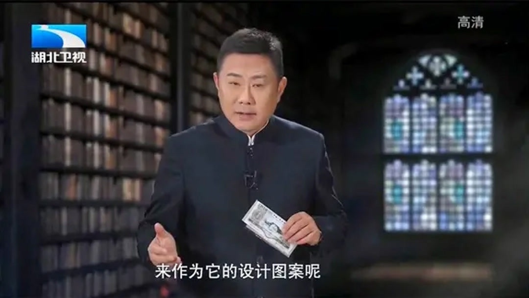中央决定制造第二套人民币,设计者将革命的三个里程碑定为图案