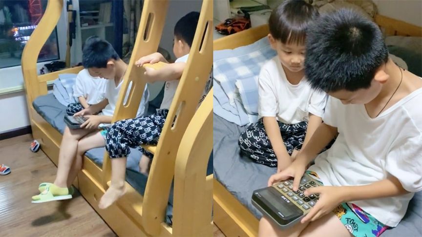 哥哥用计算器按键当琴键,一曲之后弟弟满眼崇拜