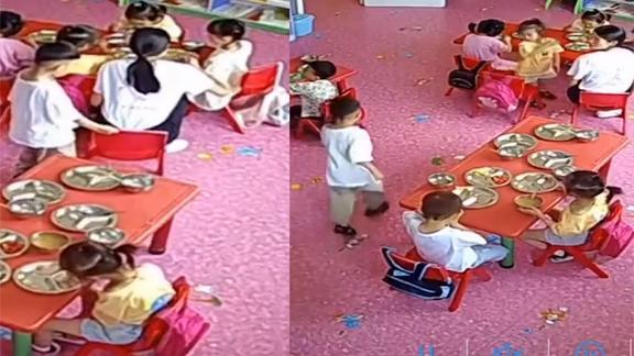 河北一幼师蹲在地上喂孩子吃饭 身旁小朋友举动让人直呼小暖男