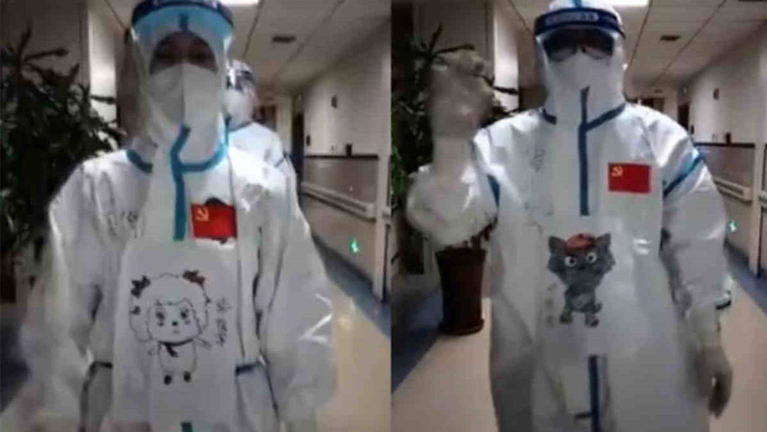 暖心!医护人员防护服上画卡通人物安抚新冠患儿