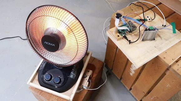 看老外手工打造高科技的自动跟踪人体的冬天加热灯瞄准器