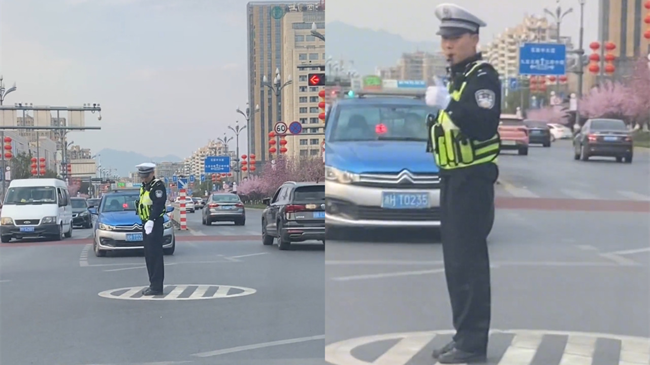 交警路口指挥交通,示意后车女车主向前一步,点赞手势太暖心!