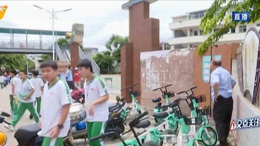 琼海初一学生轻松扫码骑车 共享电动自行车谁来管