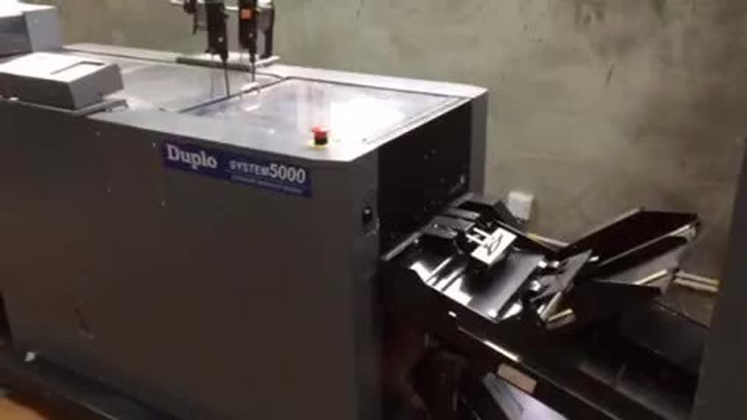 德宝配订折切一体全自动装订机,深圳市欧信宝机械设备有限公司