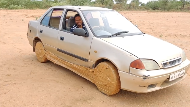 用胶带粘住汽车前后轮,汽车还能开动吗?网友:果然如此