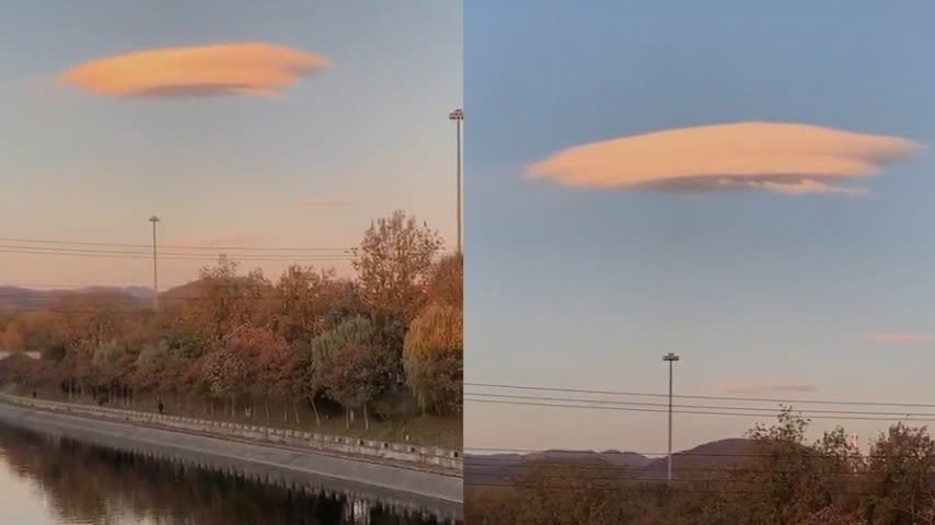 北京朝霞现玫瑰色“荚状云” 外形似飞碟