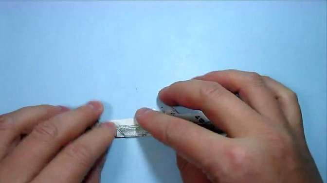 用钱折纸爱心戒指:快来一起学习一下,折一个送给你的心上人!