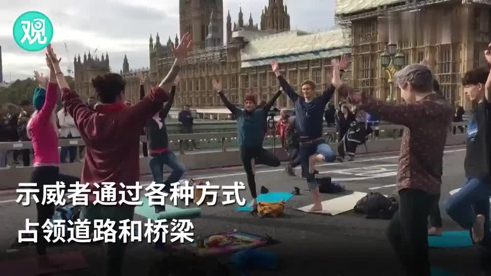 全球多地出现环保组织以各种方式占道示威,数百人被捕