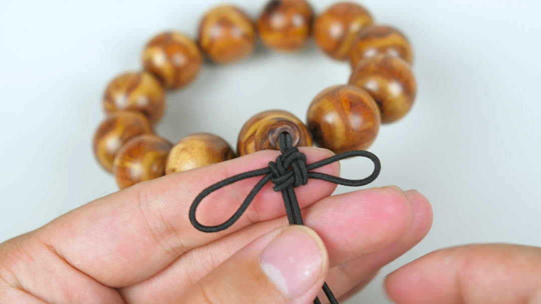 超简单,无需任何工具,教您如何编织手串中国结的方法