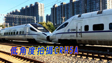 低角度拍摄CRH5A动车组经过铁路匝道口