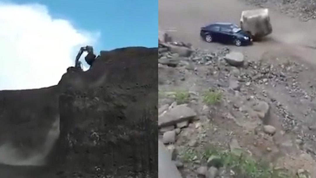 老司机山顶作业铲落巨石 高速滚动险砸轿车