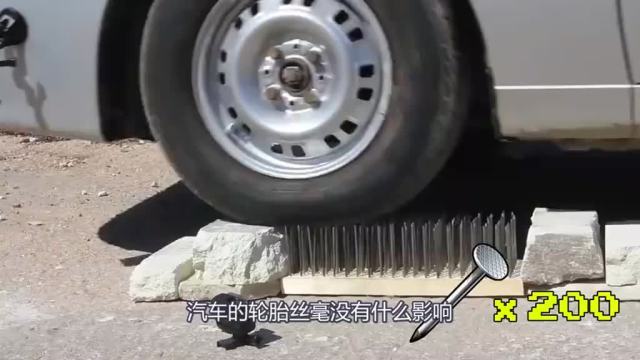 小哥用烧红的钉床去测试汽车轮胎,结果太意外了1