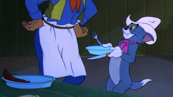 猫和老鼠:男主人在厨房做饭,是在料理烧鸡,杰瑞从洞里钻出