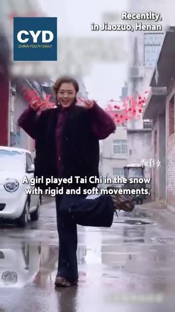 A girl played an impromptu tai chi in the snow