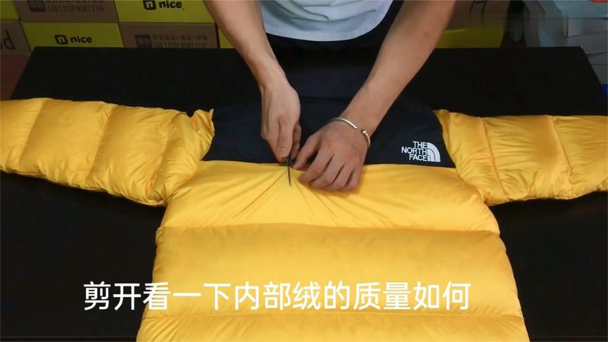 百元vs一千加 北面羽绒服充绒量如何?剪开探探究竟!