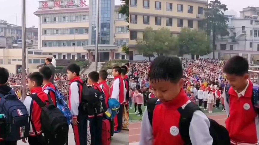 小队员们即将参加足球比赛 学校组织全体师生为他们加油鼓劲
