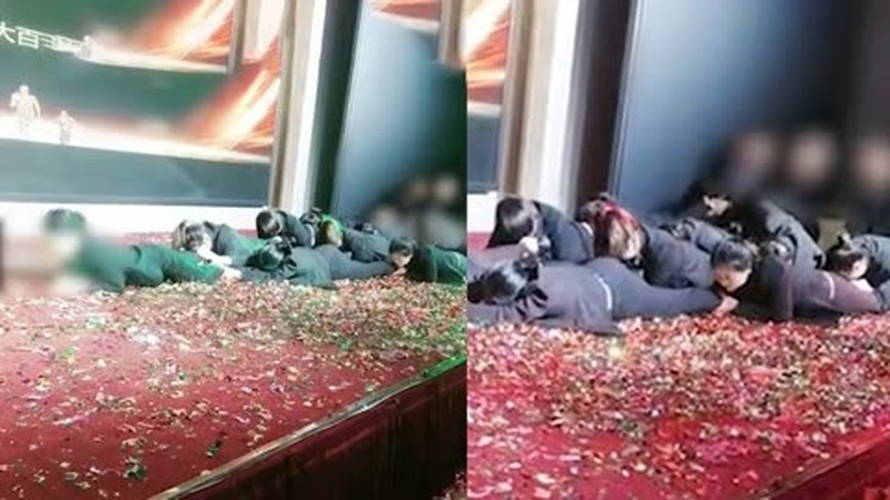 表彰大会上员工头脚相连匍匐表演:体现公司不易,老板借钱发工资