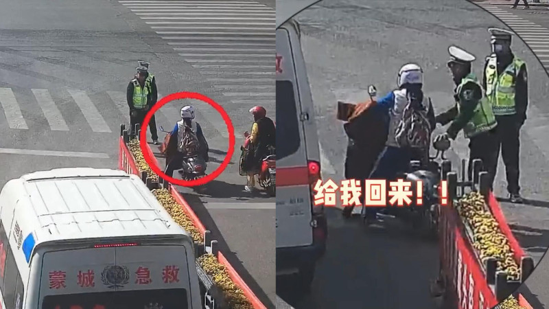 太惊险!女子骑车逆行差点撞上救护车,交警眼疾手快将其一把拉回