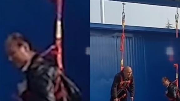 .b>高空作业不系安全绳,安全员将其吊半空教育